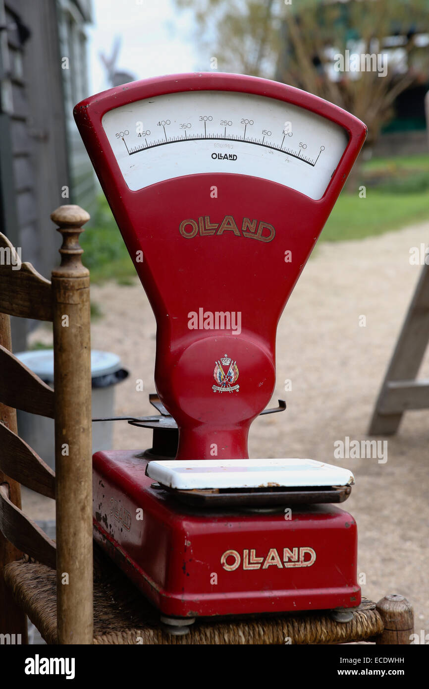 old Dutch weight scale vintage red Stock Photo - Alamy
