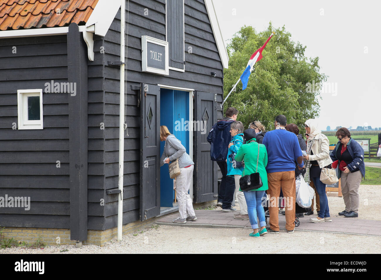 people tourist lineup toilet washroom Holland Europe Stock Photo - Alamy