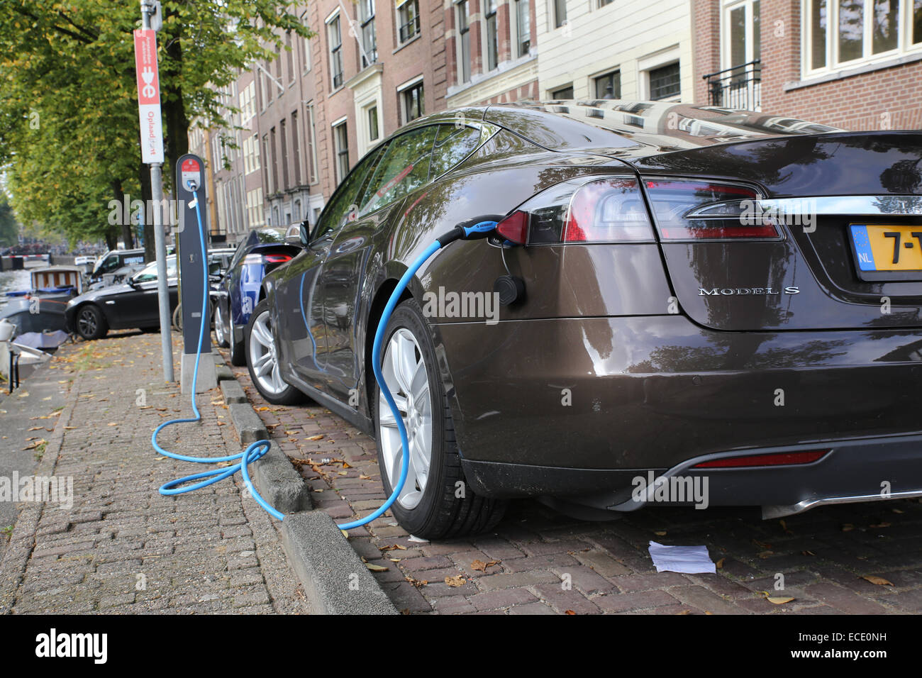 charging electric car outside blue cable Europe Stock Photo - Alamy