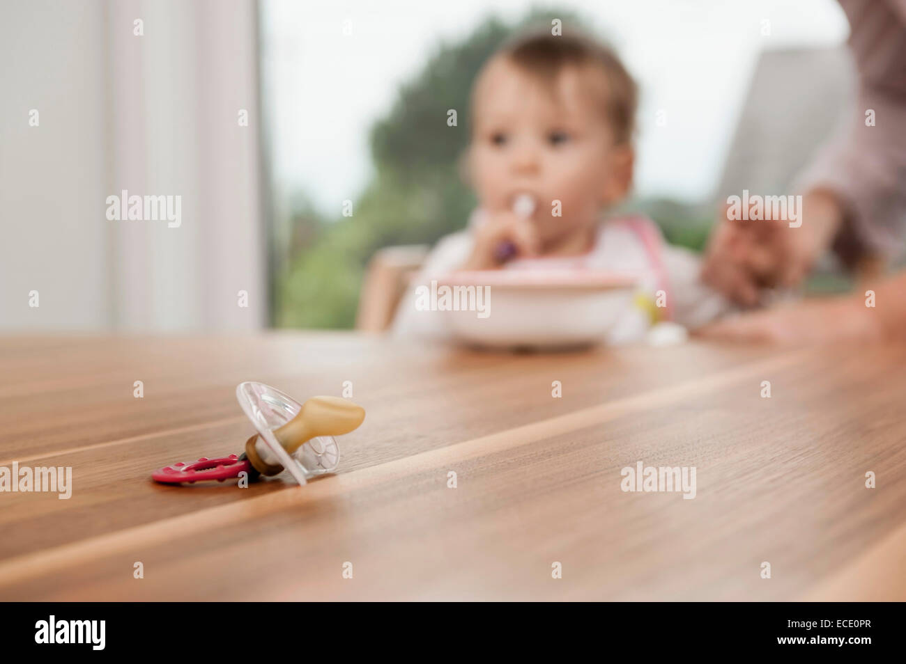 Baby Pacifier dummy table selective focus Stock Photo - Alamy