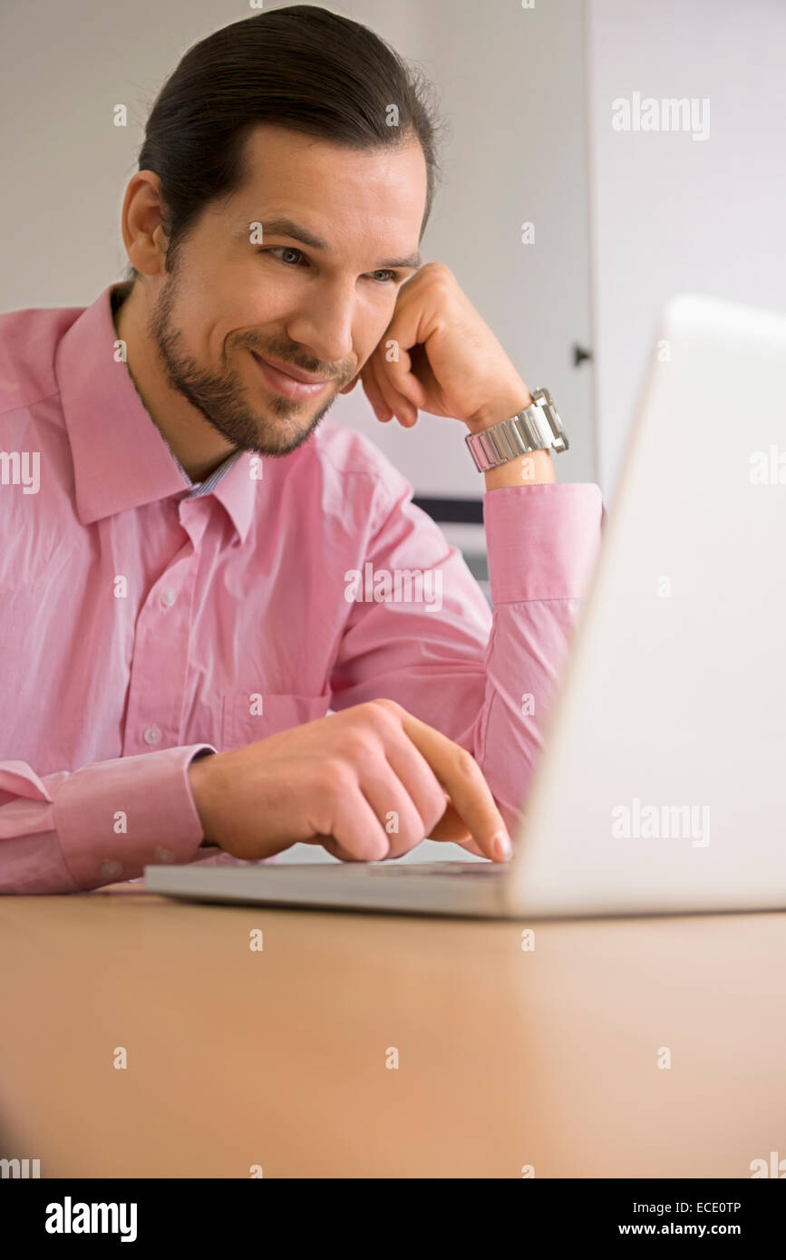 office computer man working smiling typing laptop Stock Photo - Alamy