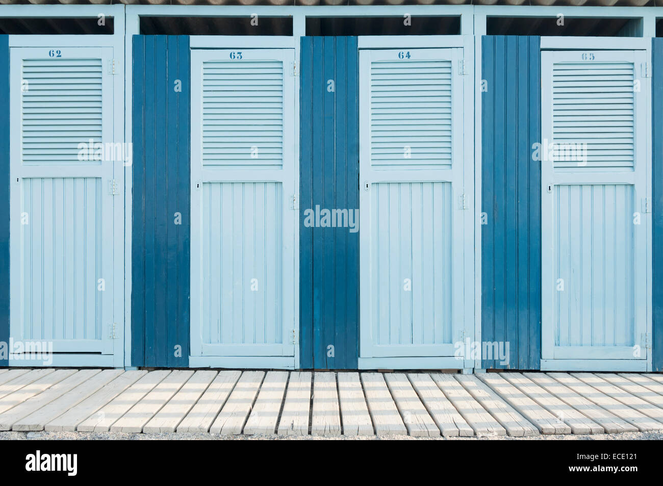 Row changing cubicle beach summer Italy blue Stock Photo - Alamy
