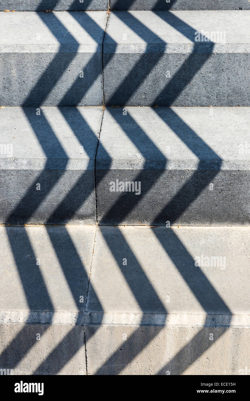 Shadows in straight lines on a gray stone staircase Stock Photo - Alamy