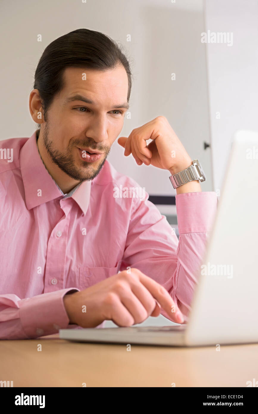 Twitter typing man office laptop computer close-up Stock Photo - Alamy