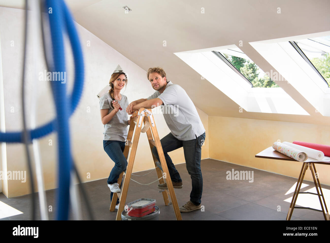 Man climbing out of window hi-res stock photography and images - Alamy