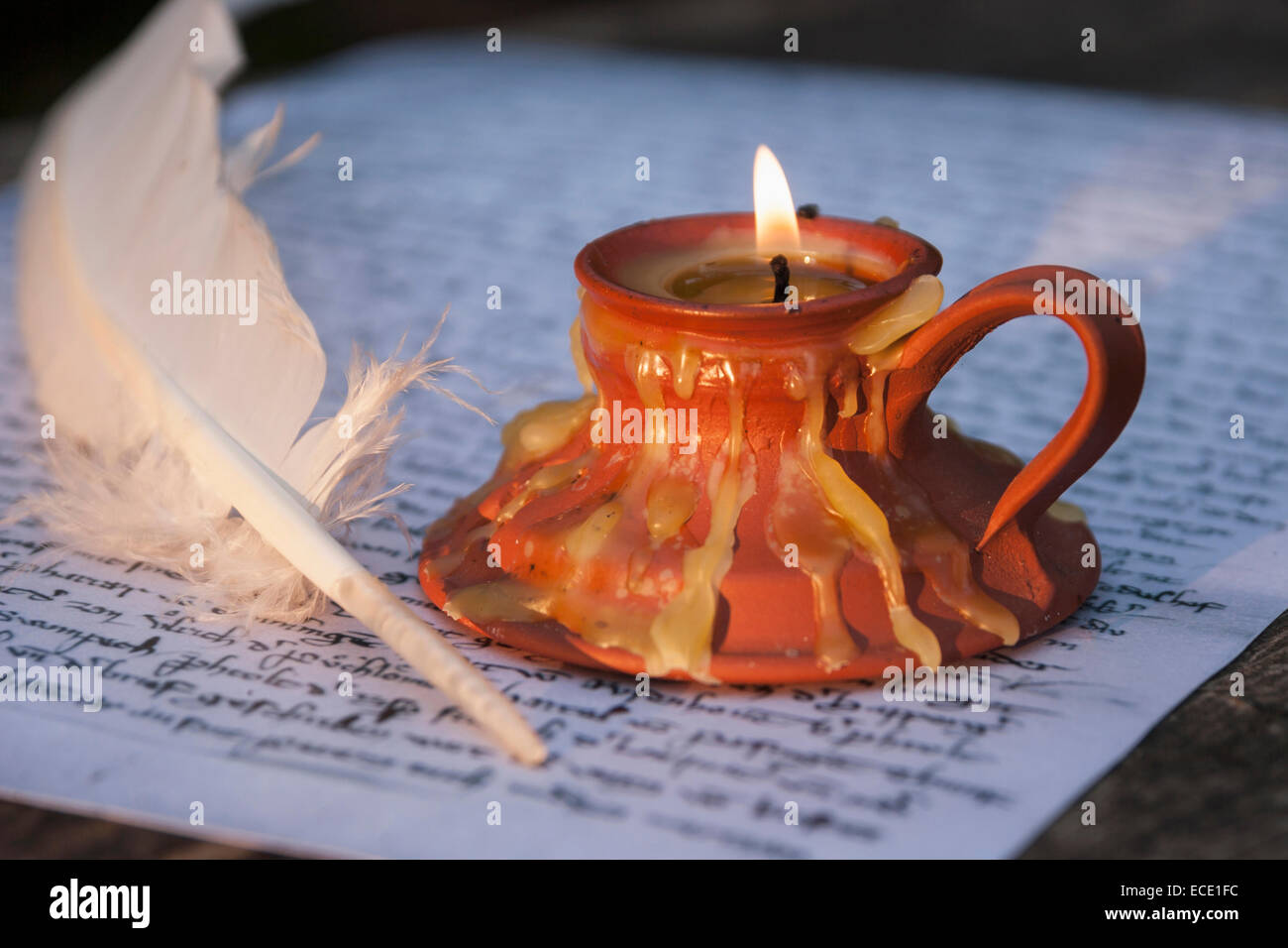 Document with quill and candle Stock Photo - Alamy