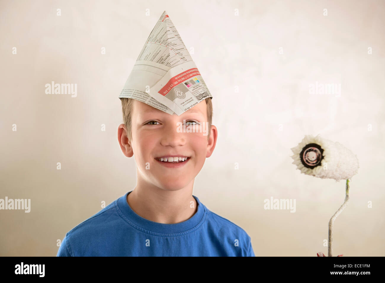 Portrait boy paper hat painting decorating Stock Photo - Alamy