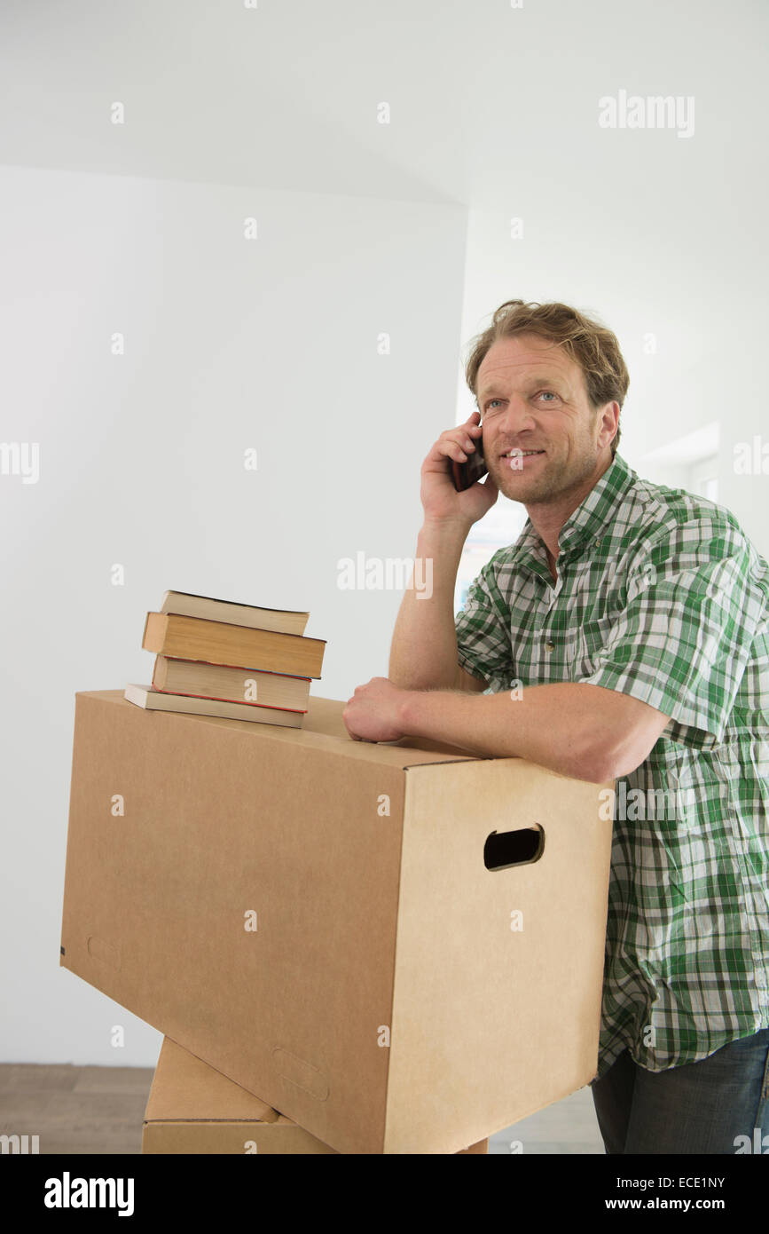 Man leaning on pile boxes hi-res stock photography and images - Alamy