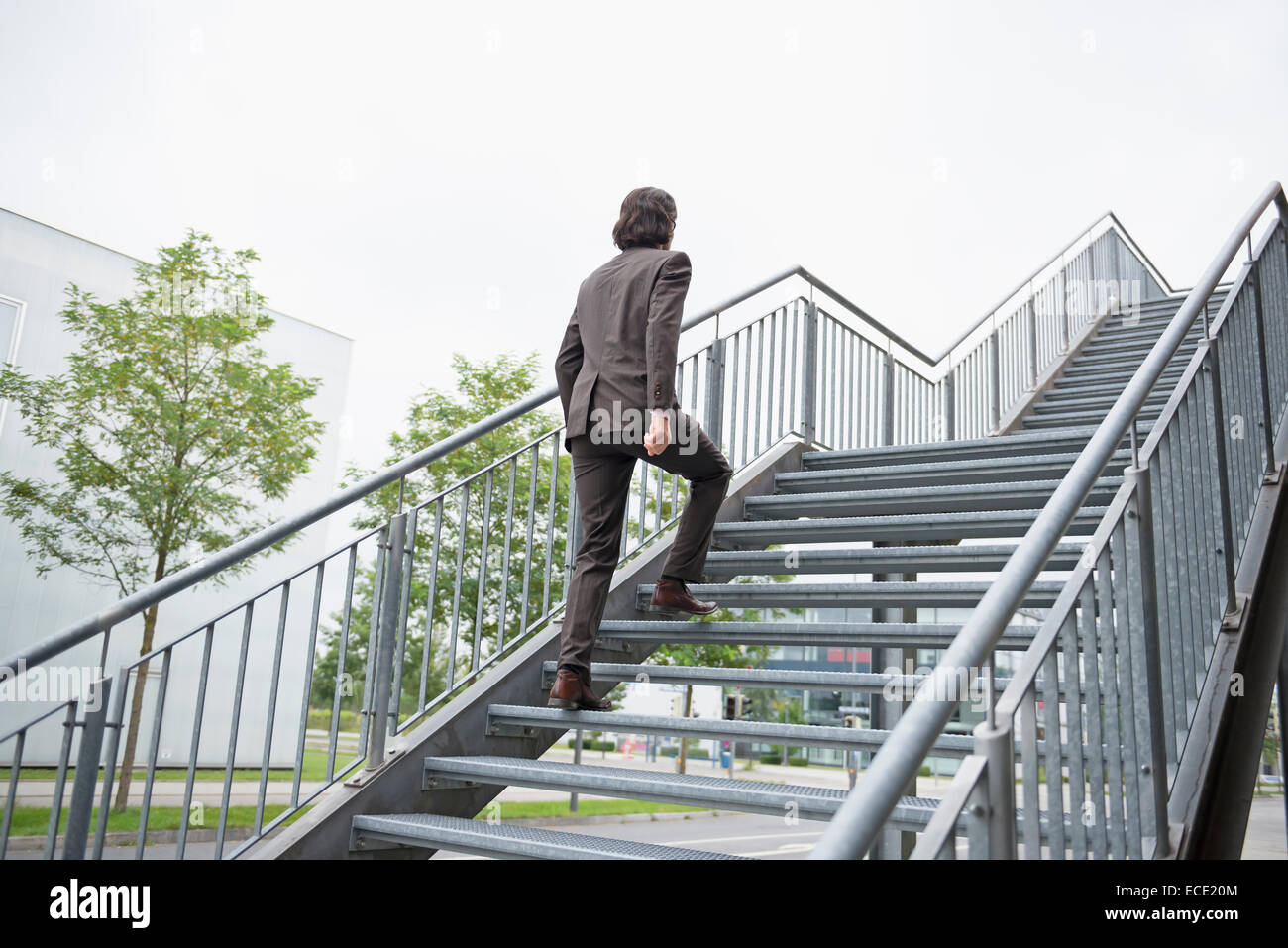 Young businessman ascent ladder of success job Stock Photo - Alamy
