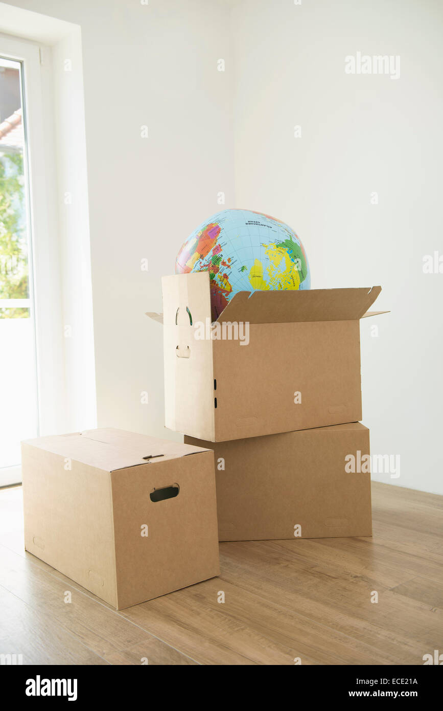 Empty room new apartment boxes moving in Stock Photo - Alamy