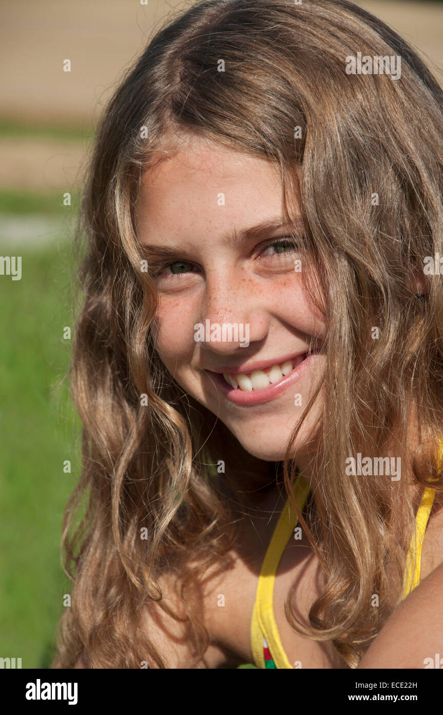 Portrait of a girl (12-13) in field, close-up Stock Photo - Alamy