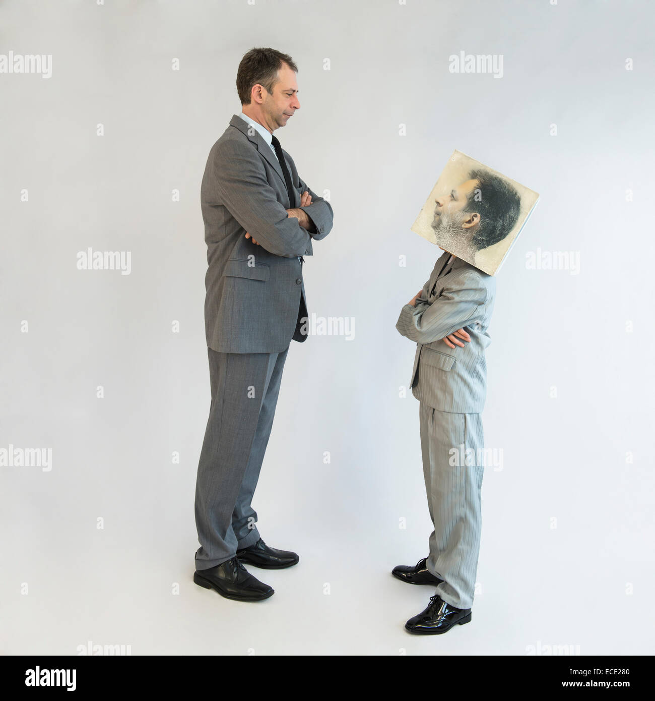 businessman and boy wearing mask standing face to face Stock Photo - Alamy