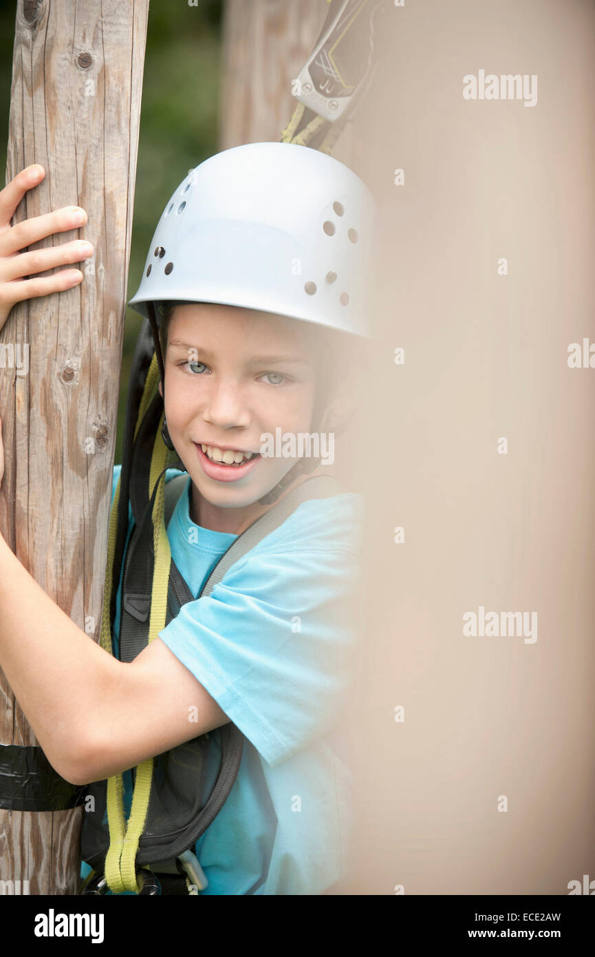 Portrait of boy climbing crag Stock Photo - Alamy