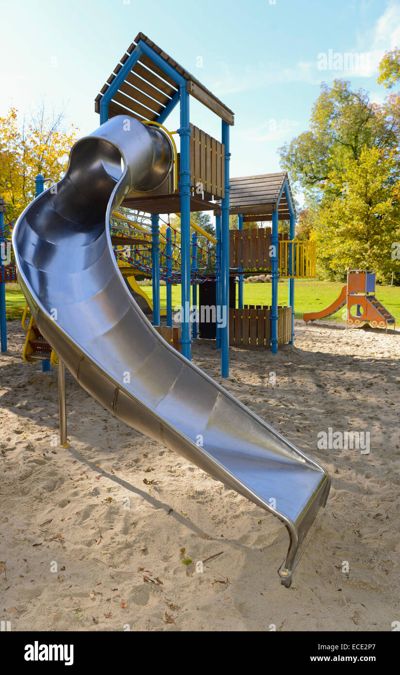 View of slide in playground Stock Photo - Alamy