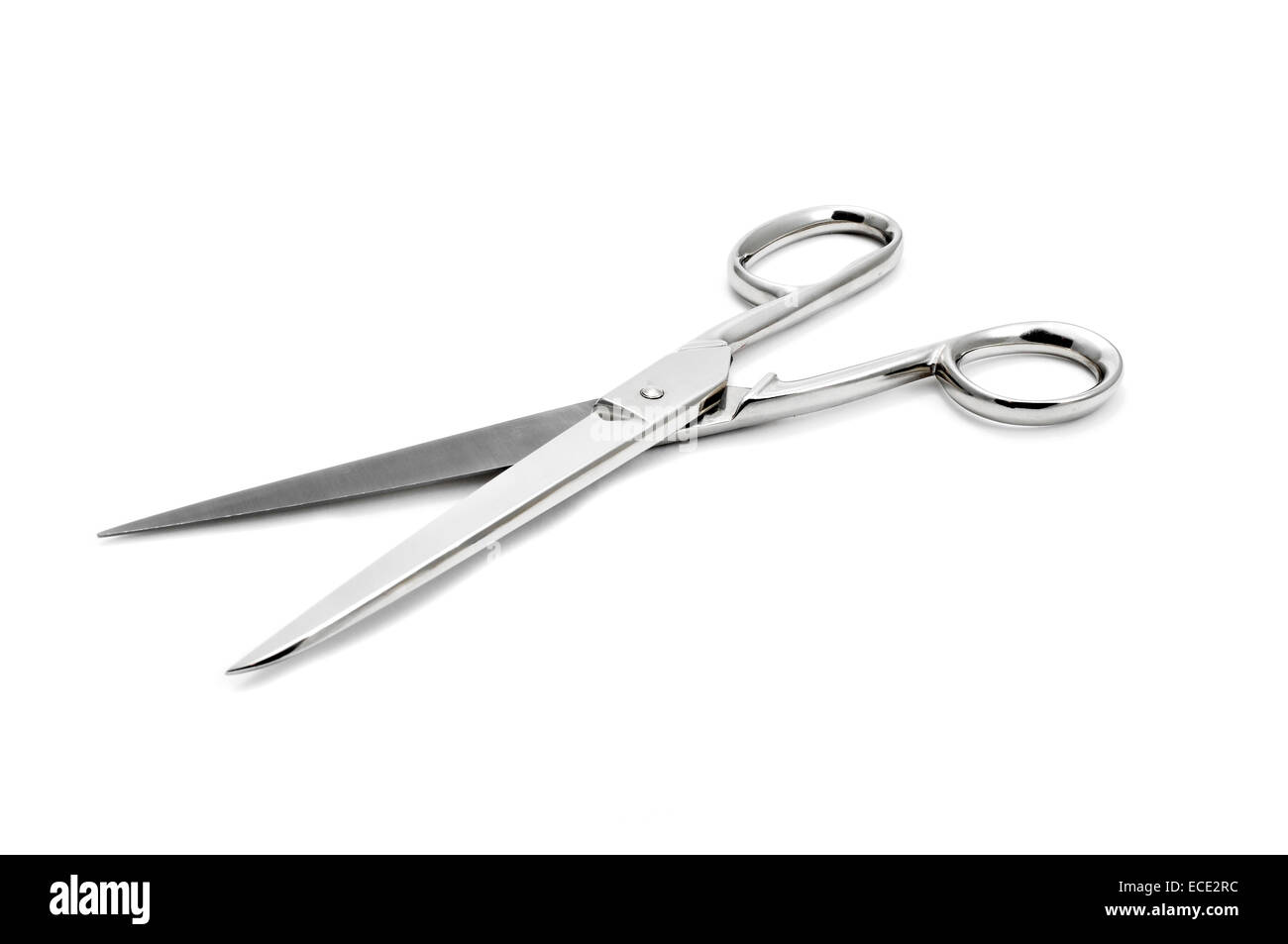 new sewing scissors on a white background Stock Photo - Alamy