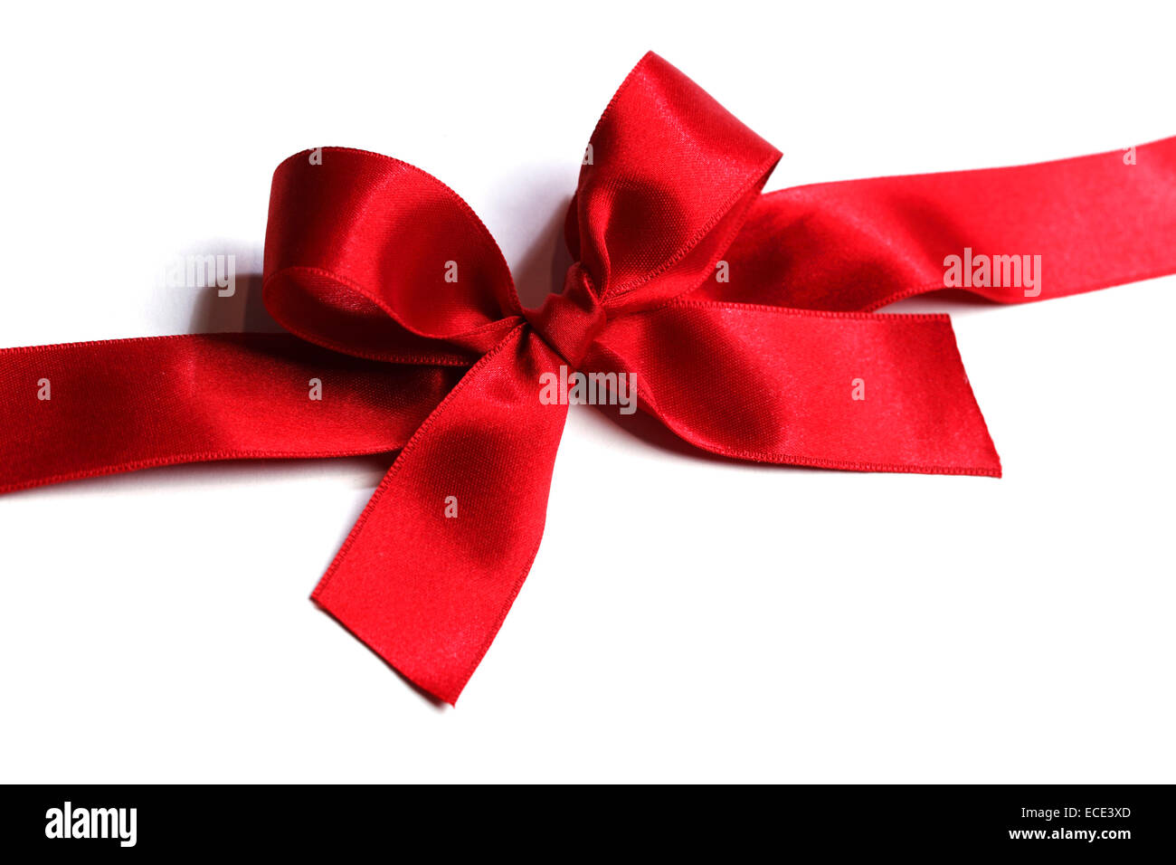 Shiny red satin bow isolated on white background Stock Photo - Alamy