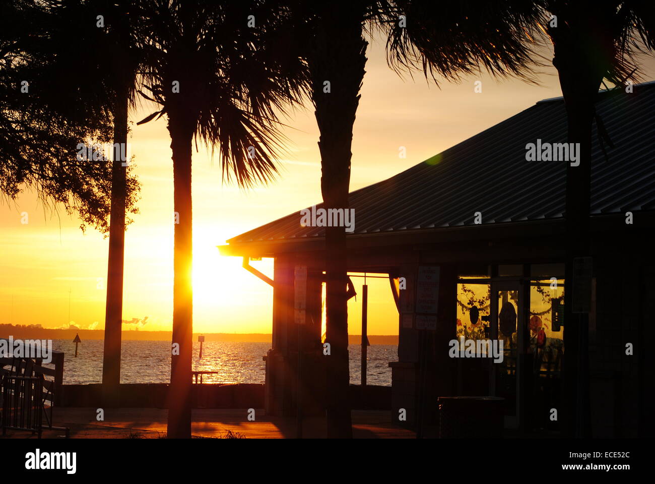 Sunrise,seen at Ballast Point Park,from the Tampa Bay shore line ...