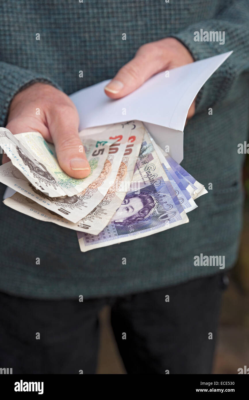 Hand out envelope hi-res stock photography and images - Alamy