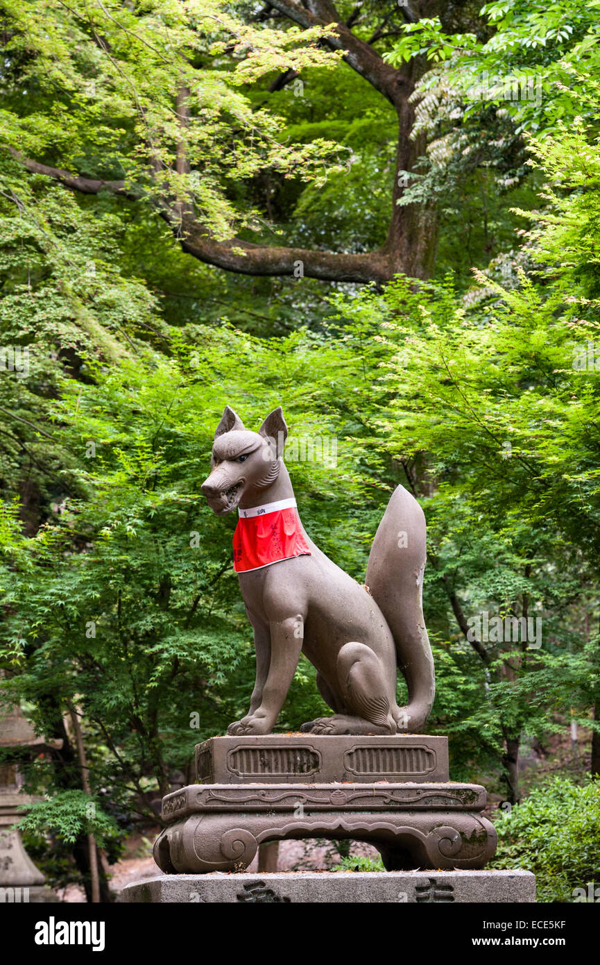 A kitsune (fox spirit) at the shrine of Fushimi Inari-taisha, kami (god ...