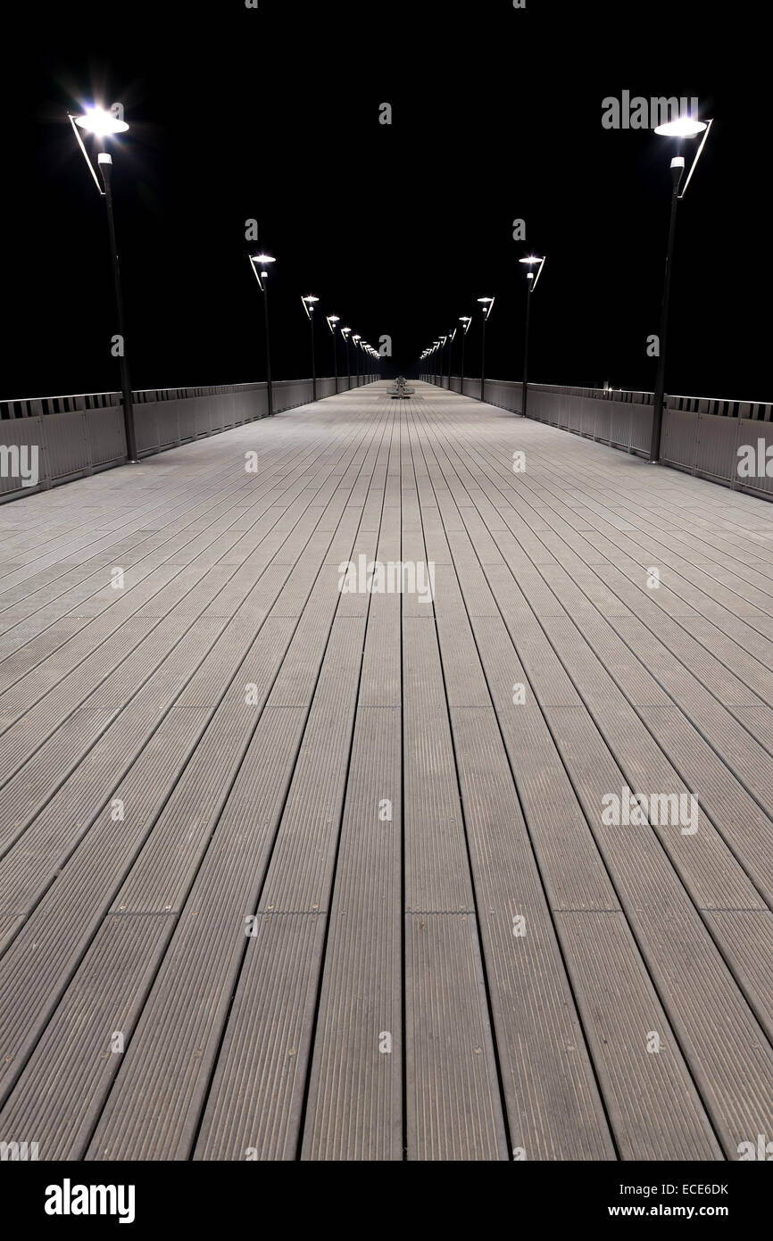 Night view of a pier and lamp posts Stock Photo - Alamy