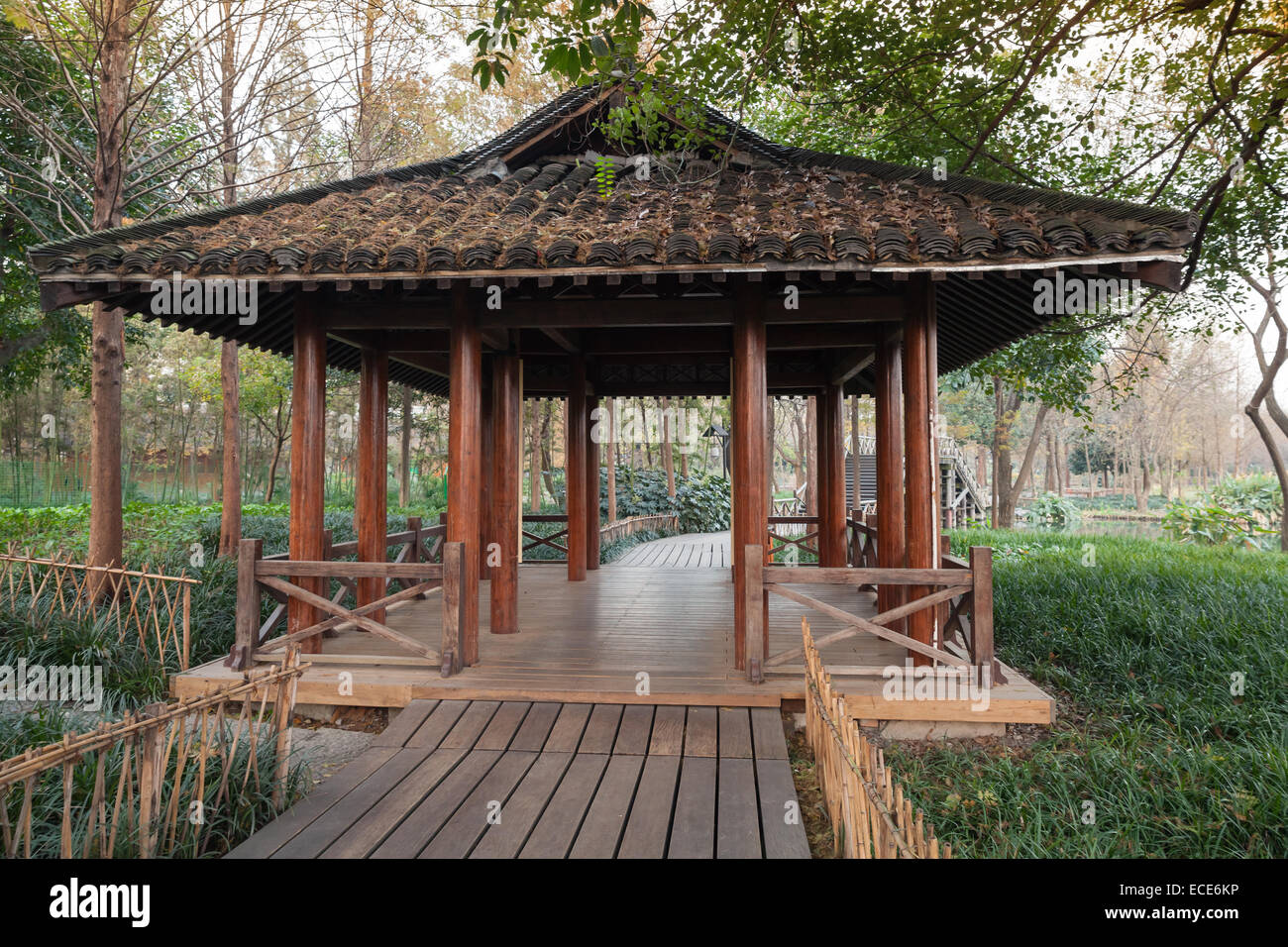 Wooden pathway and traditional Chinese Gazebo. Walking around famous ...