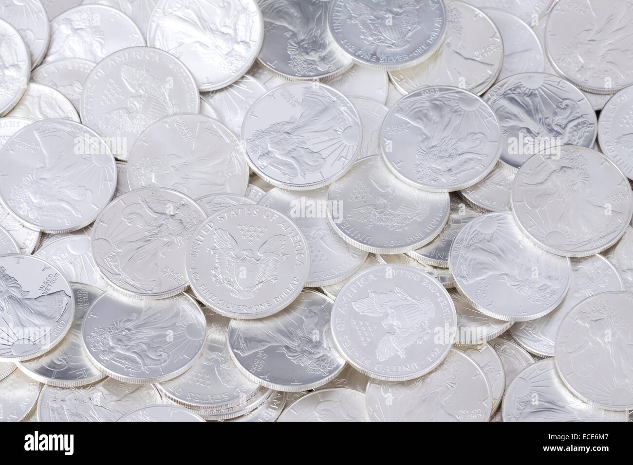 Silver shiny one dollar coins, money background Stock Photo - Alamy