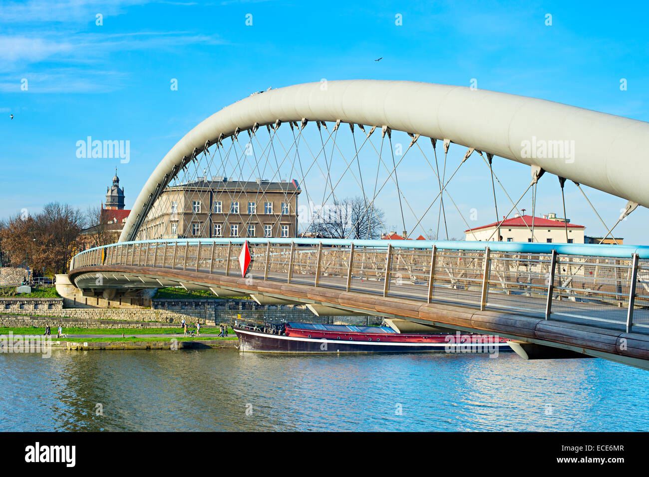 Side view of Father Bernatek Footbridge across the Wisla river. Krakow ...