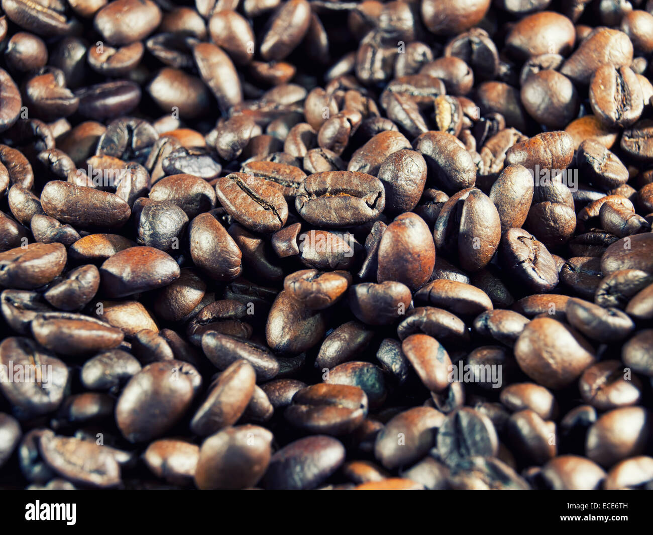 Whole beans of delicious roasted coffee Stock Photo - Alamy