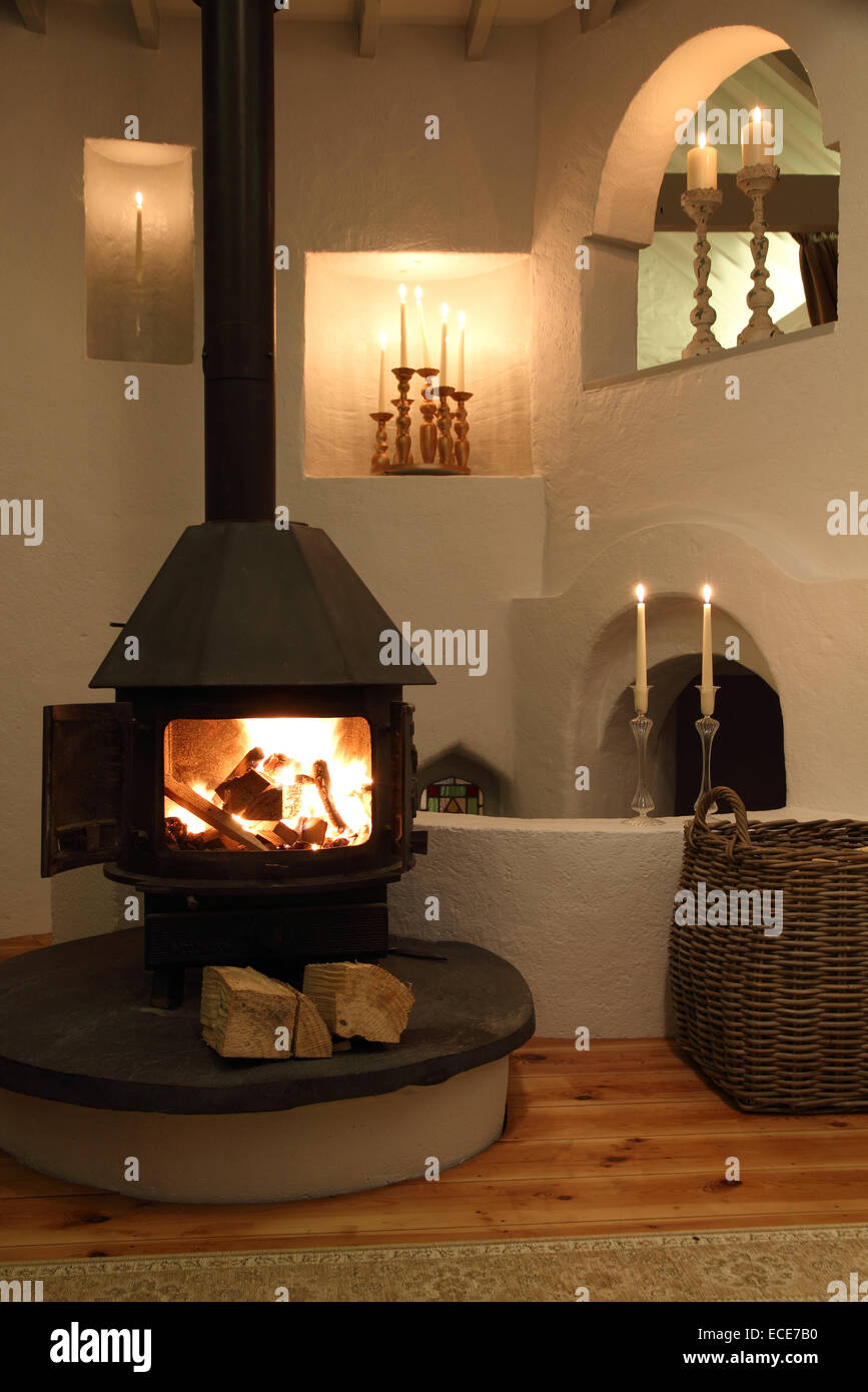 Cosy living/sitting room with fire Stock Photo - Alamy
