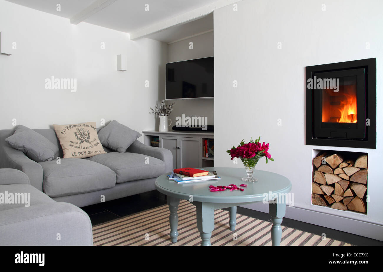 Cosy living/sitting room with fire Stock Photo - Alamy