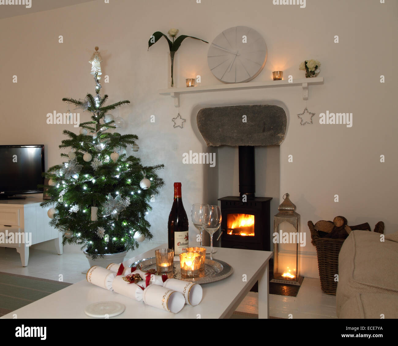 Cosy living/sitting room with fire Stock Photo - Alamy