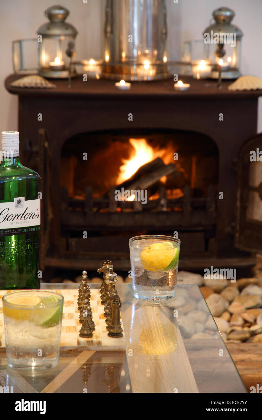 Cosy living/sitting room with fire Stock Photo - Alamy