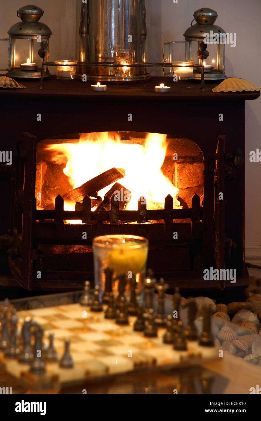 Cosy living/sitting room with fire Stock Photo - Alamy