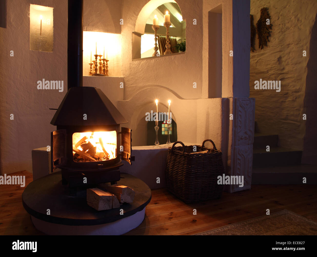 Cosy living/sitting room with fire Stock Photo - Alamy