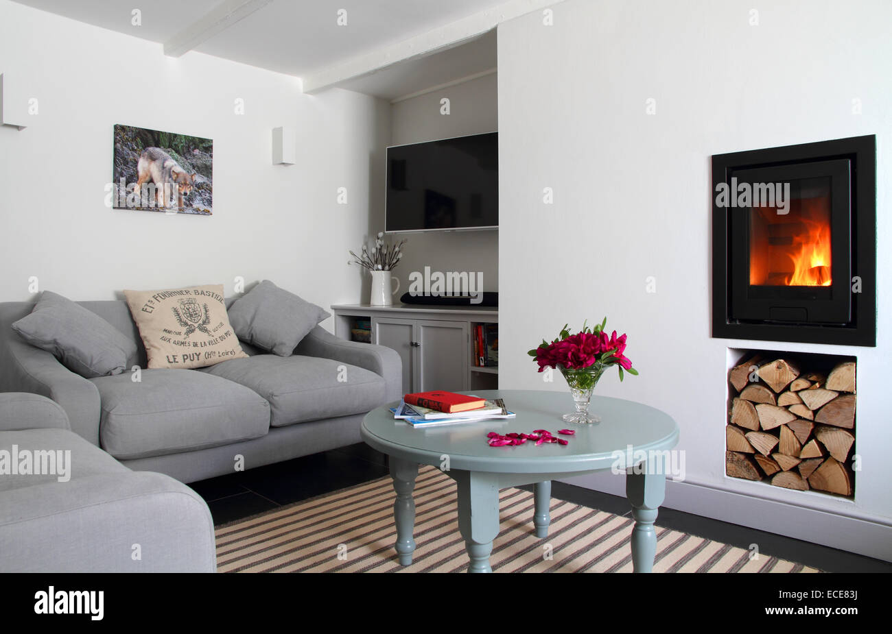 Cosy living/sitting room with fire Stock Photo - Alamy