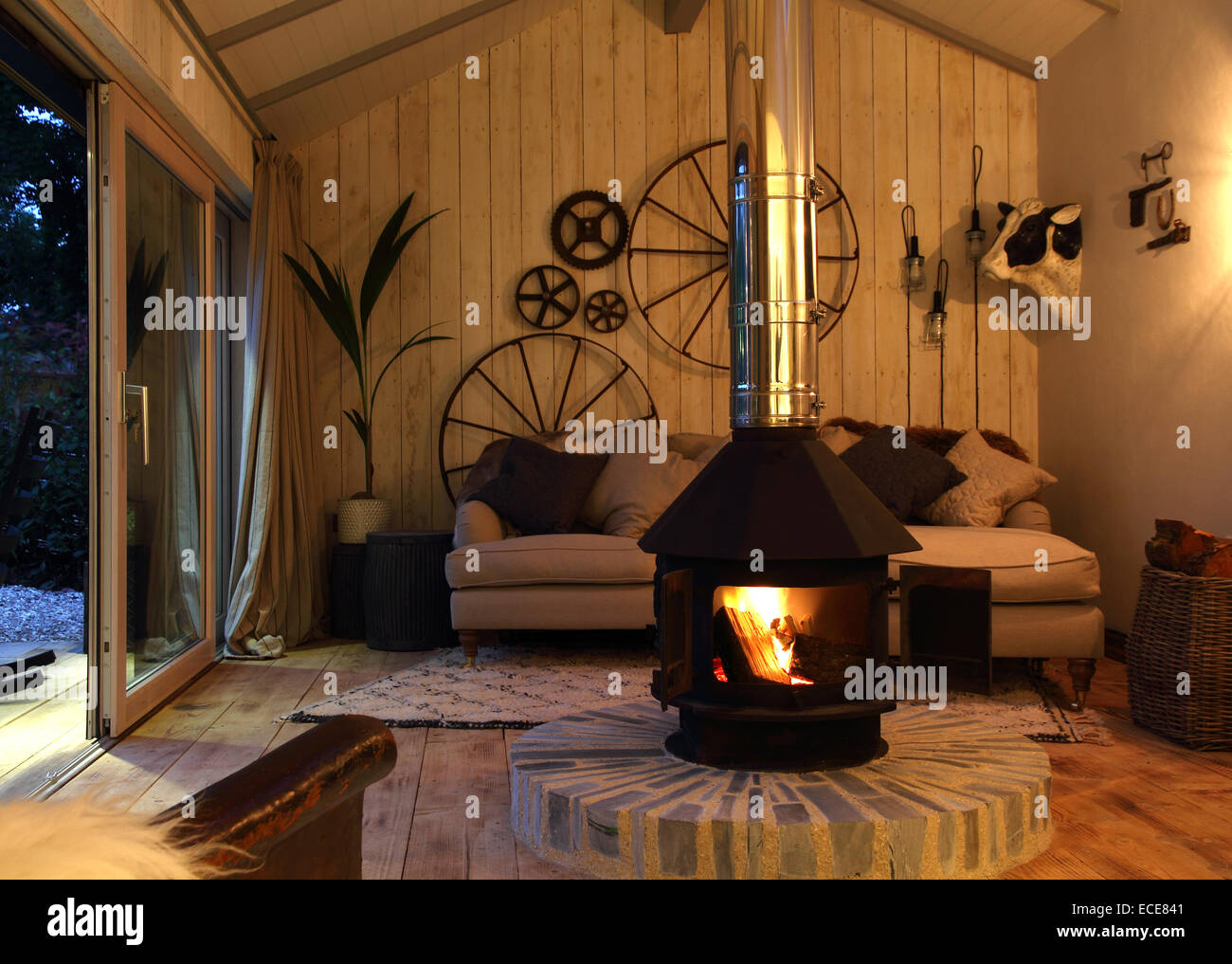 Cosy living/sitting room with fire Stock Photo - Alamy