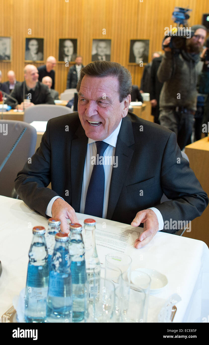 Former German chancellor Gerhard Schroeder (SPD) sits smiling as a ...