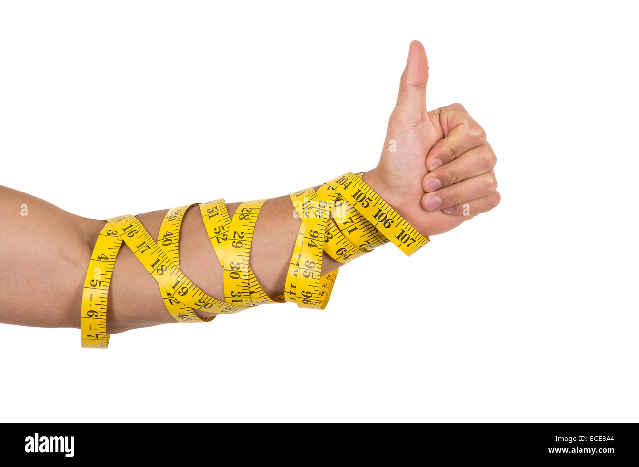 man's arm wrapped in measuring tape holding thumb up Stock Photo - Alamy