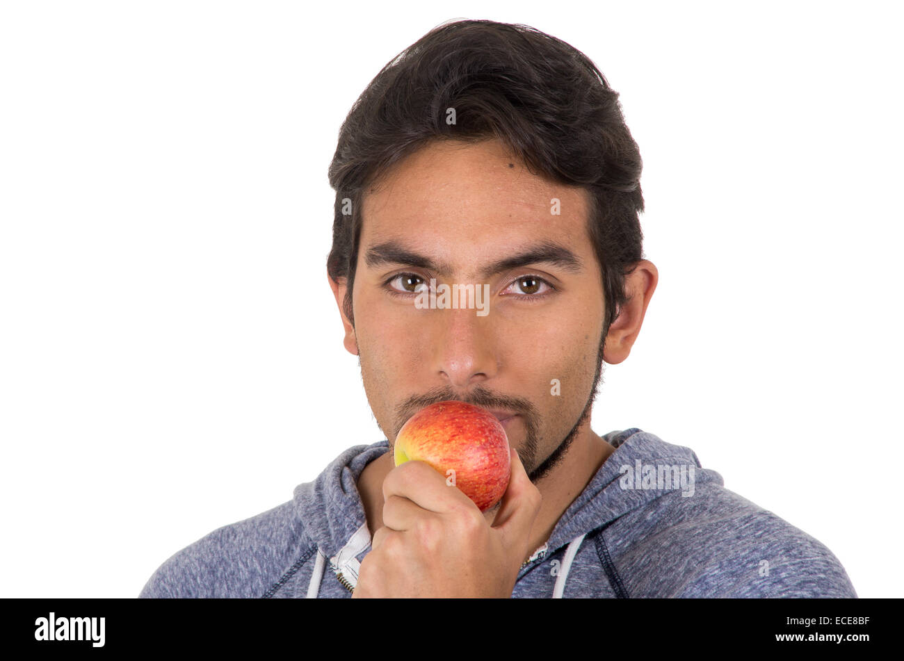 handsome young man biting red apple Stock Photo - Alamy