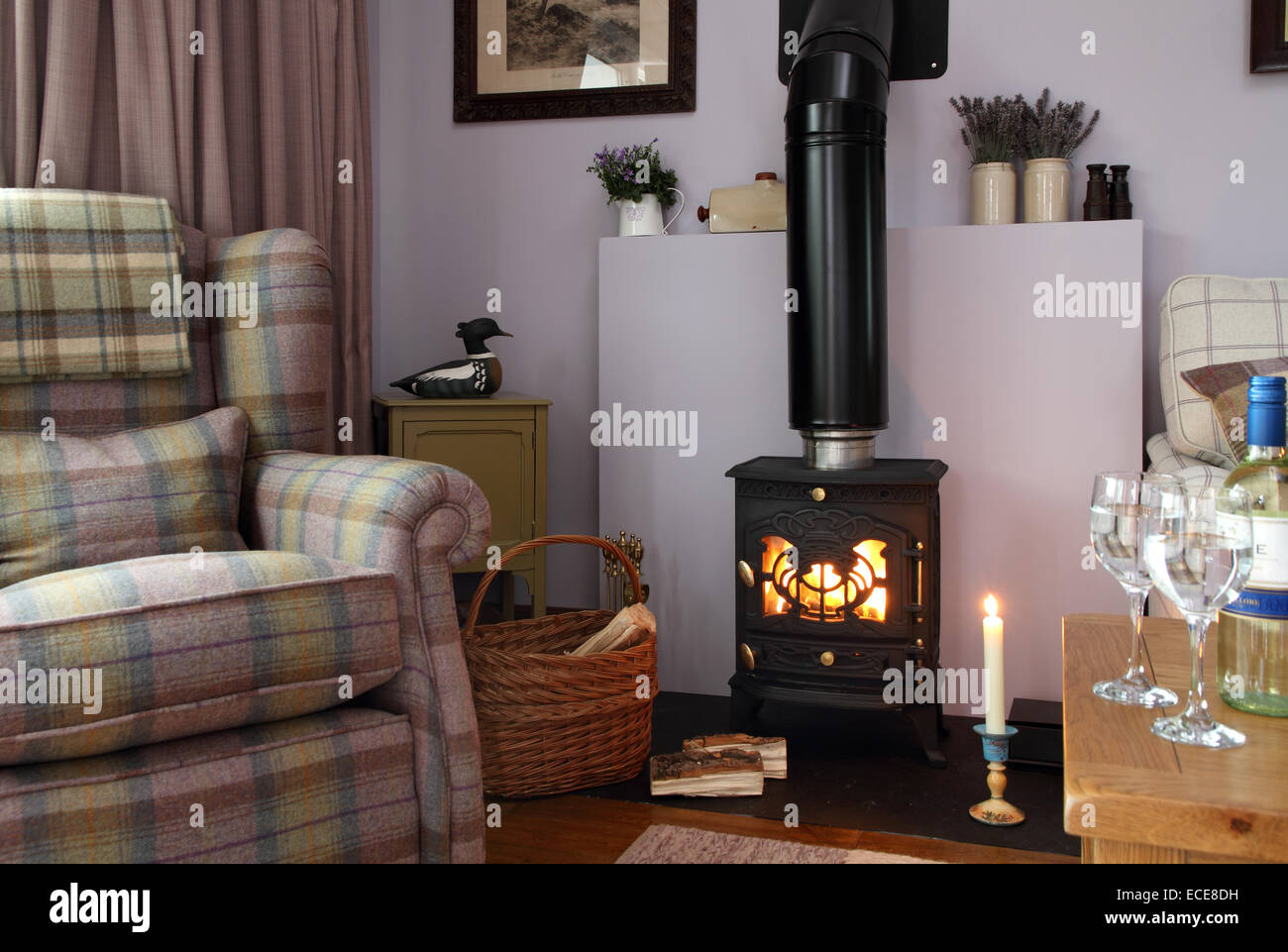 Cosy living/sitting room with fire Stock Photo - Alamy