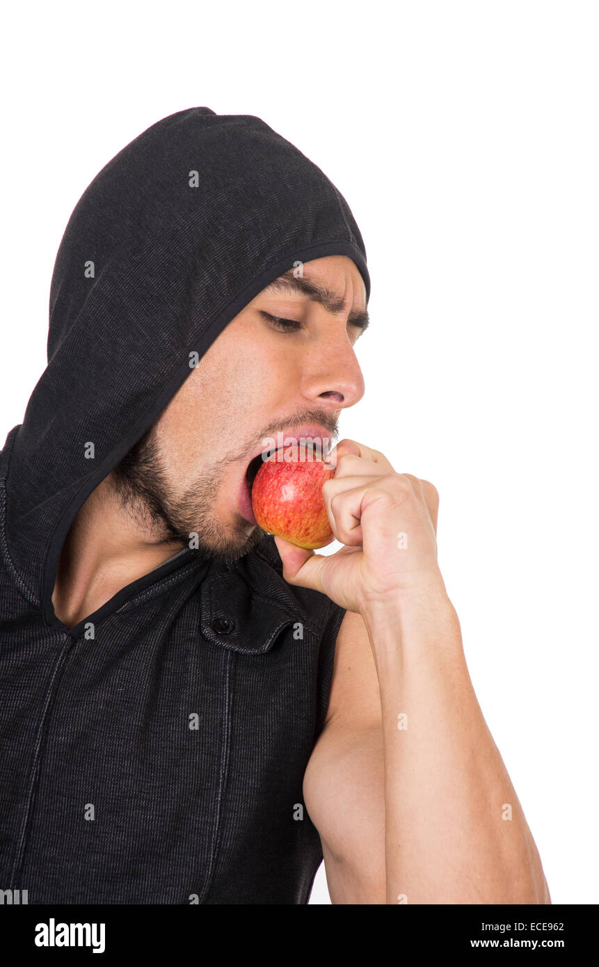 handsome young man biting red apple Stock Photo - Alamy