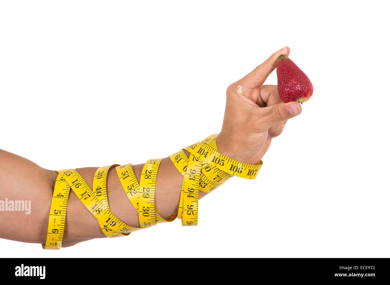 man's arm wrapped in measuring tape holding red strawberry Stock Photo ...