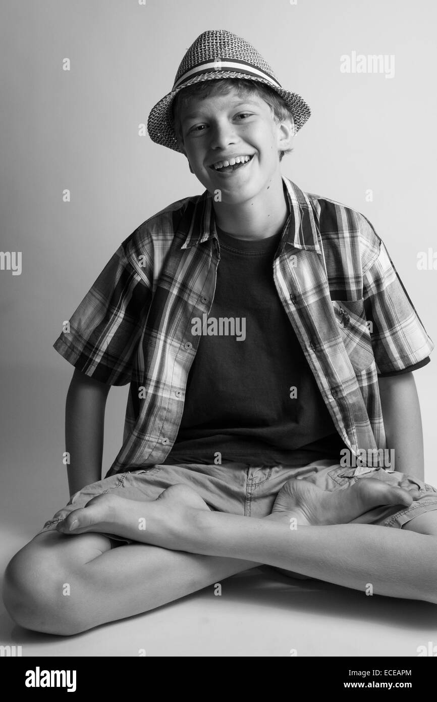 Child sitting cross legged Black and White Stock Photos & Images - Alamy