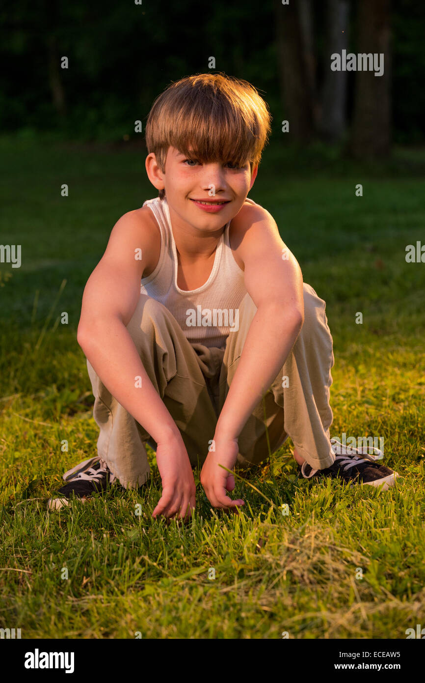 Portrait of a smiling boy at sunset Stock Photo - Alamy