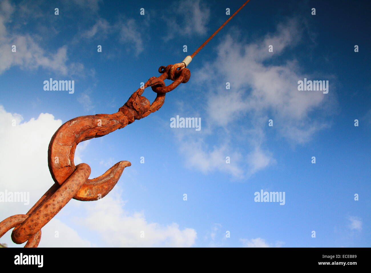 Rusty hook with sky in background Stock Photo - Alamy
