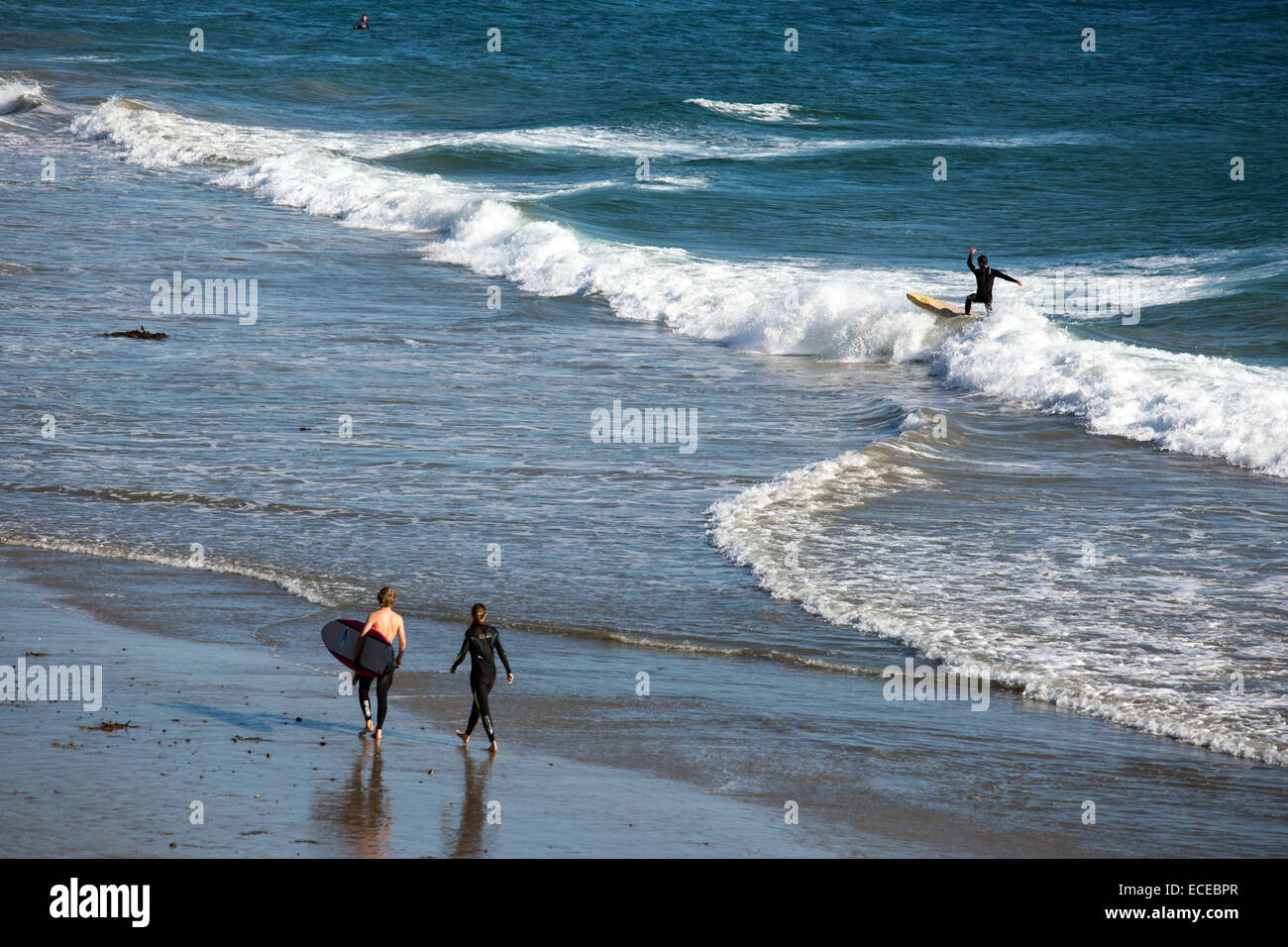 Surfers on the beach in California Stock Photo - Alamy