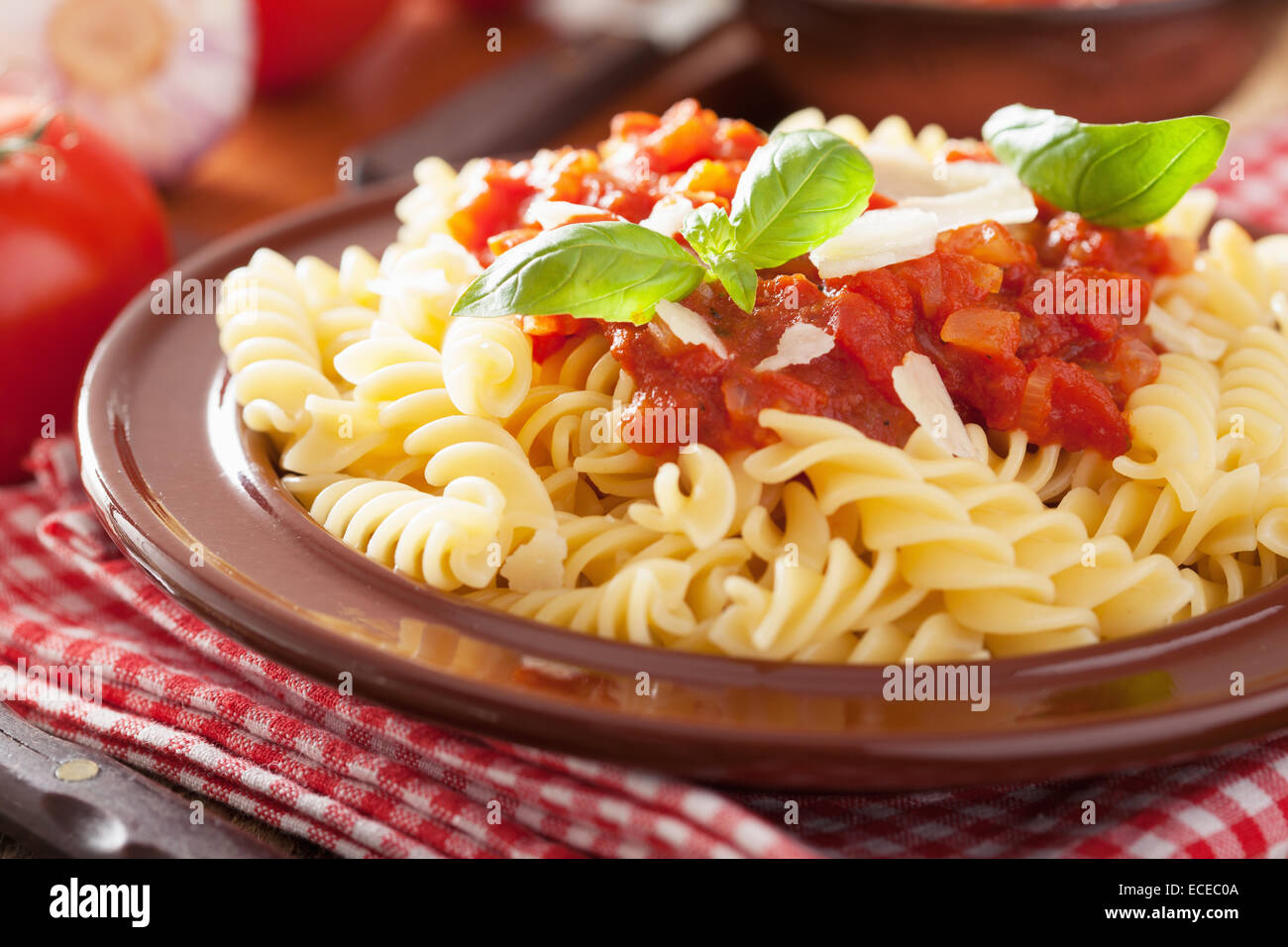 italian classic pasta fusilli with tomato sauce and basil Stock Photo ...