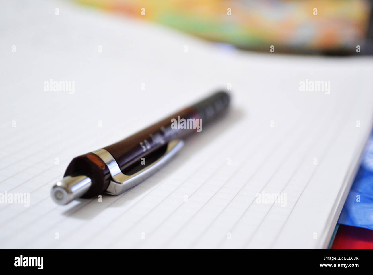 A pen on a notebook Stock Photo - Alamy