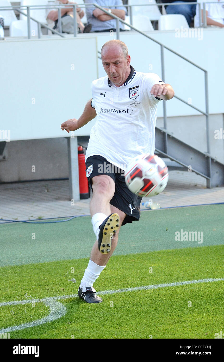 Retired football stars from Germany and Portugal playing a charity ...