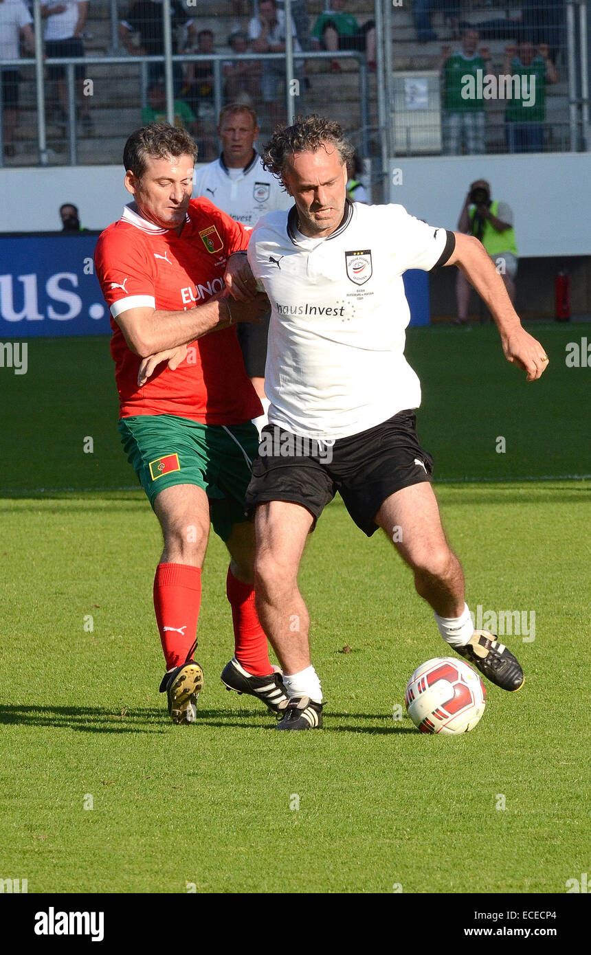 Retired football stars from Germany and Portugal playing a charity ...